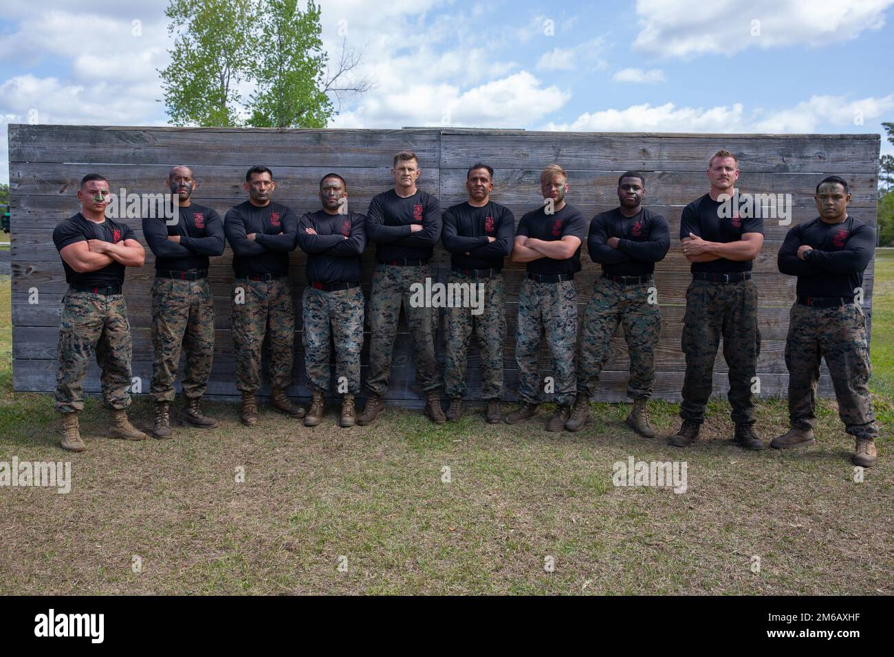U.S. Marine Corps Martial Arts Instructor (MAI) trainers pose for a ...
