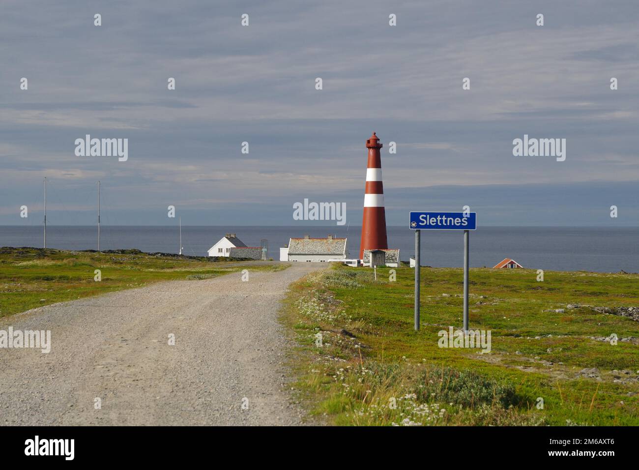 The world's northernmost lighthouse and a gravel road, barren landscape ...