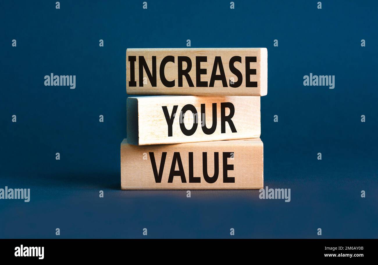Increase your value symbol. Concept words Increase your value on wooden ...