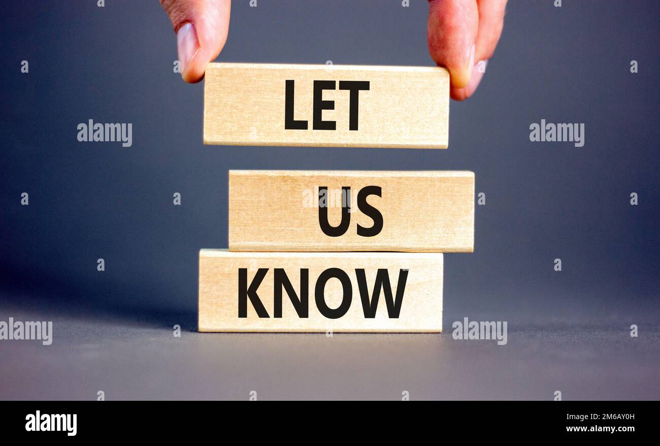 Let us know symbol. Concept words Let us know on wooden blocks on a ...
