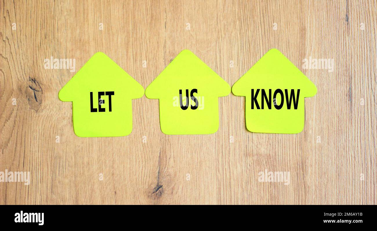 Let us know symbol. Concept words Let us know on green paper house on a ...