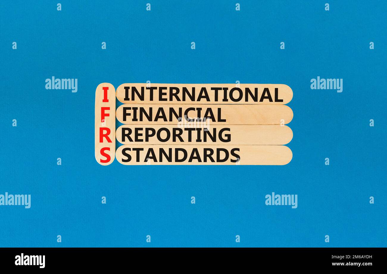 IFRS symbol. Concept words IFRS international financial reporting standards on wooden stick on ...