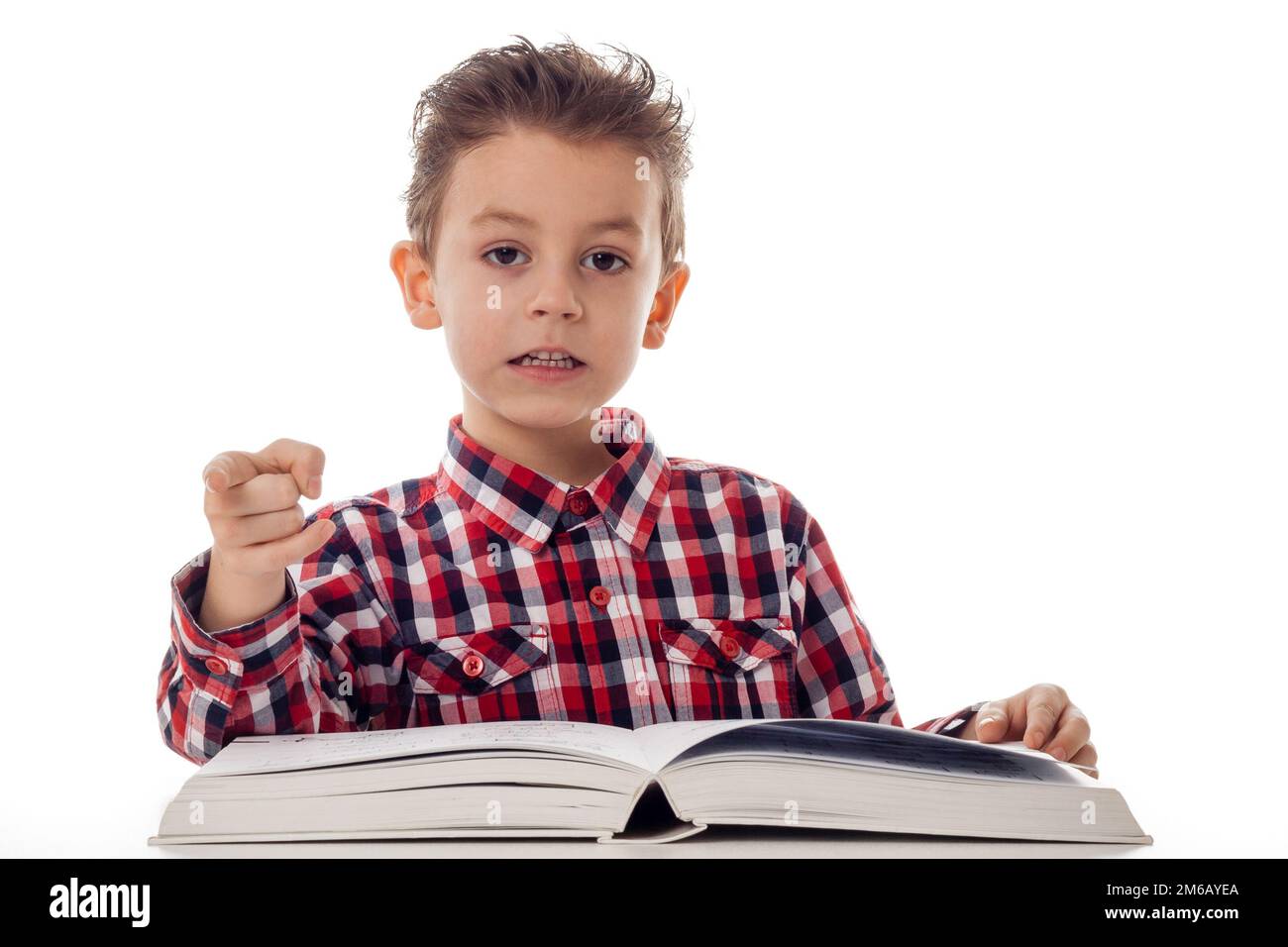 Boy pointing at book hi-res stock photography and images - Alamy