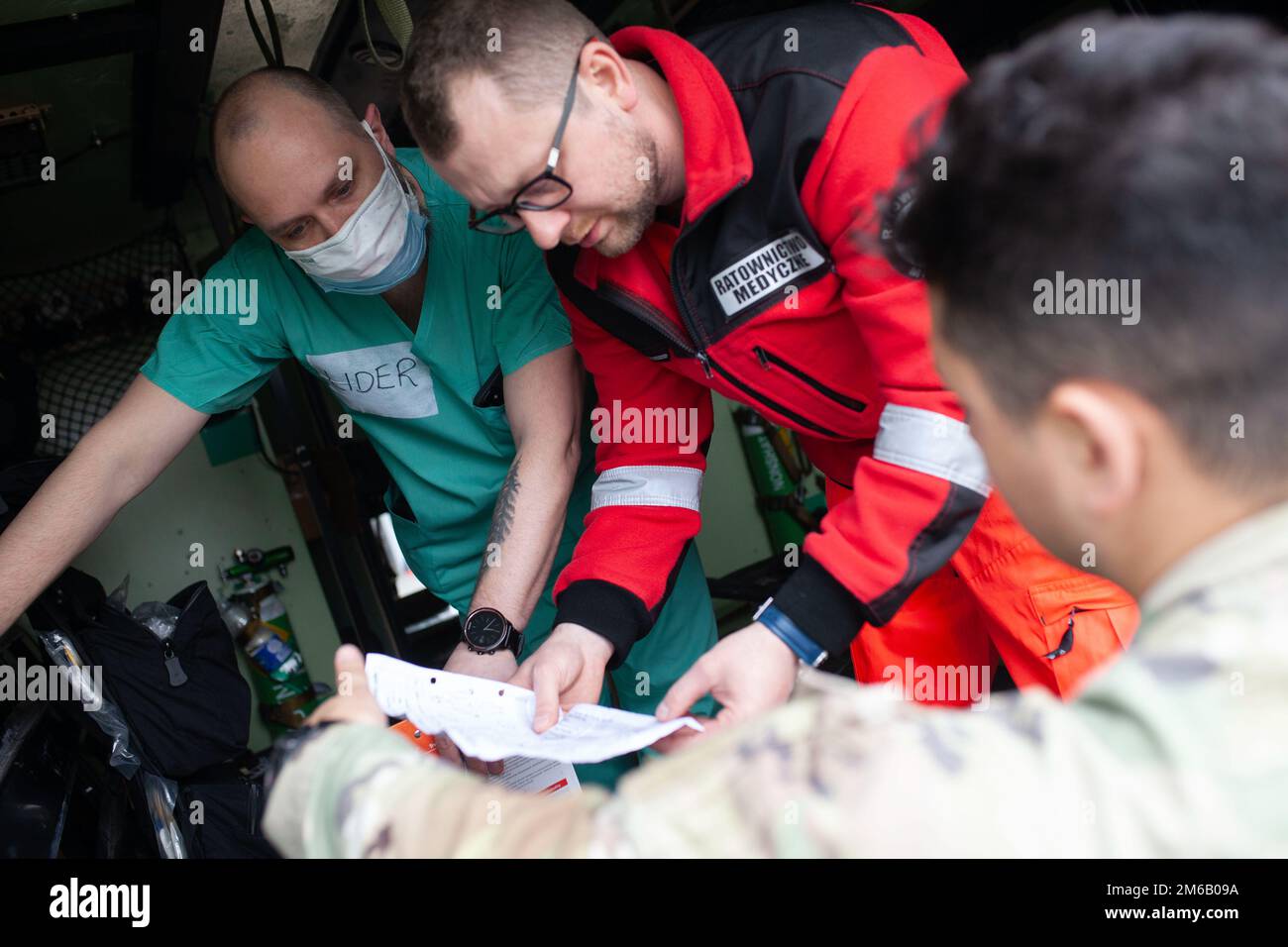 A U.S. Army medic from 142nd MCAS shows and explains a nine-line chart ...