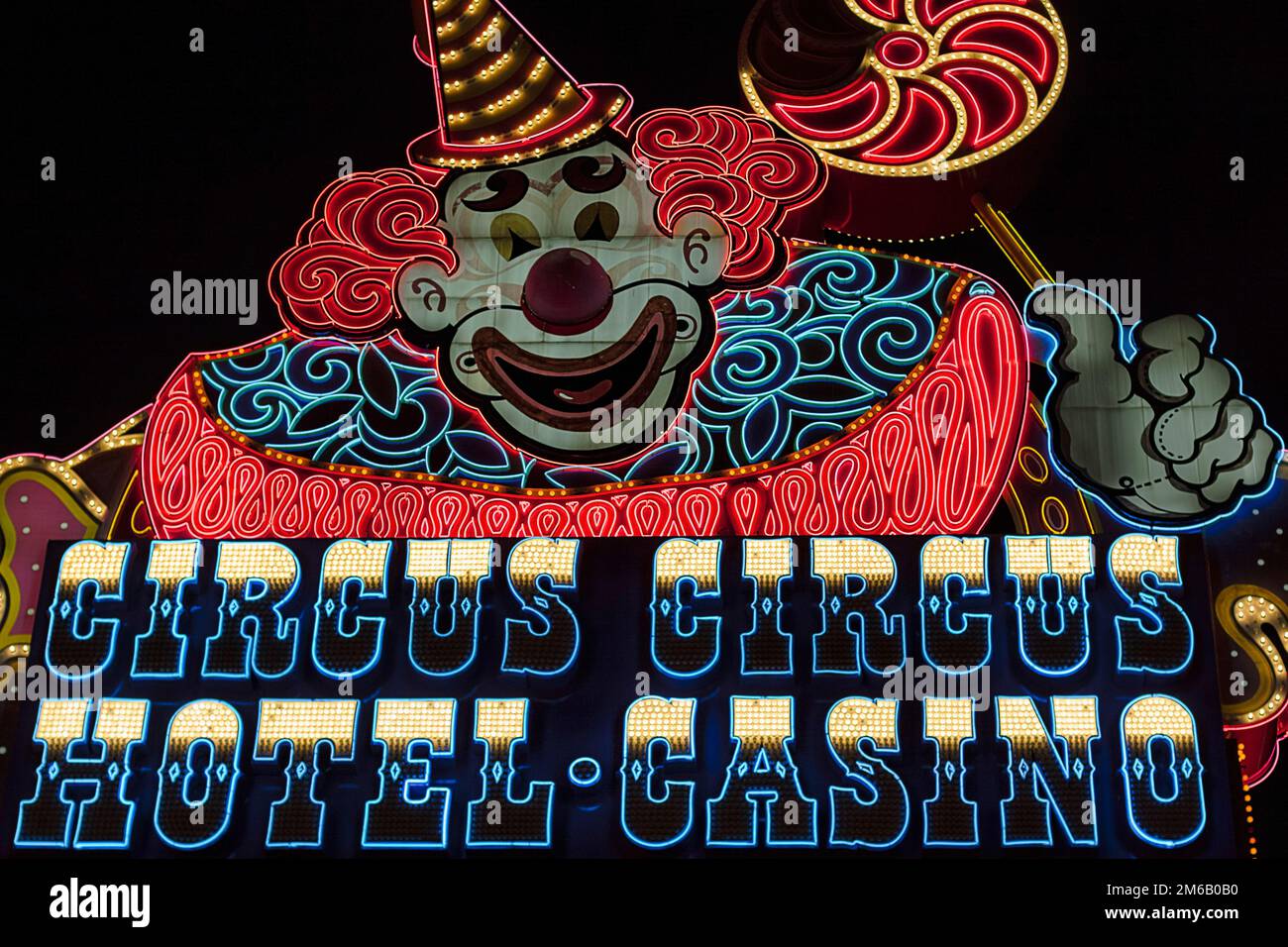 Illuminated sign at night, with clown and lettering Circus Circus ...