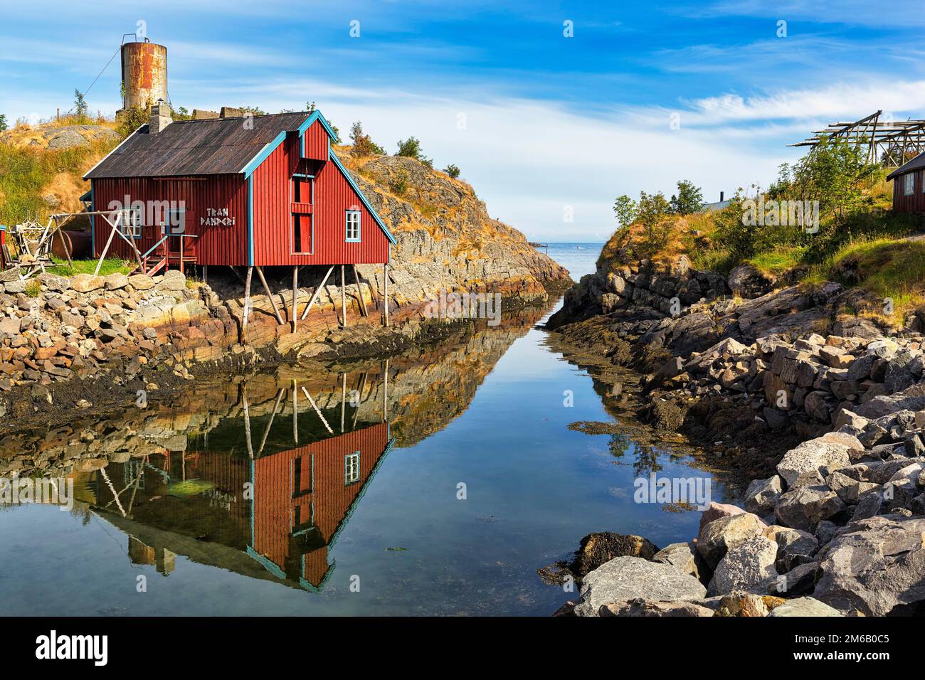 Red traditional fishing hut, sunny weather, Norwegian Fishing Village ...
