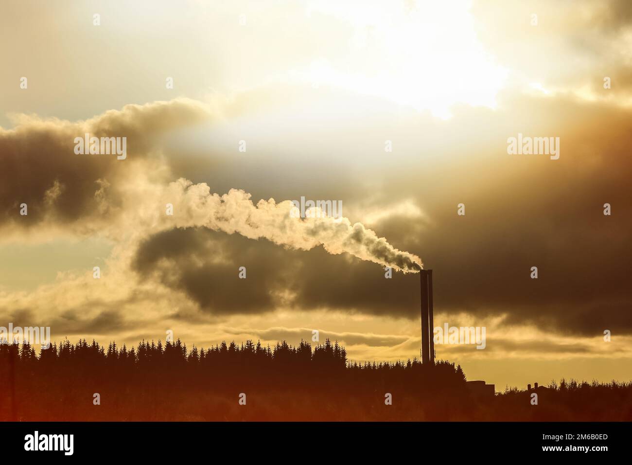 Heat station pipe on the background of dramatic cloudy sky as a concept ...