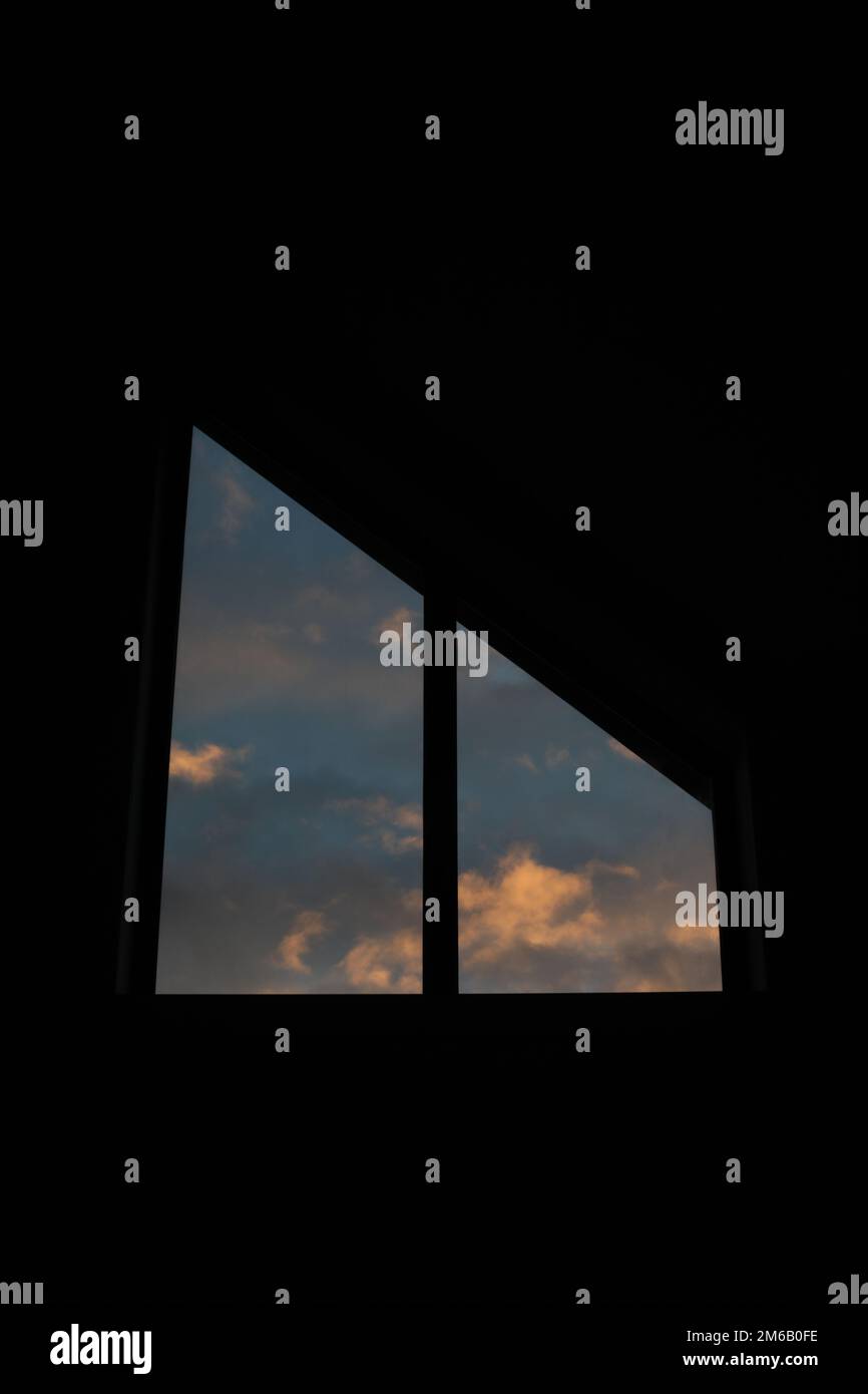 The view from the window of the dramatic sunset sky with clouds Stock ...