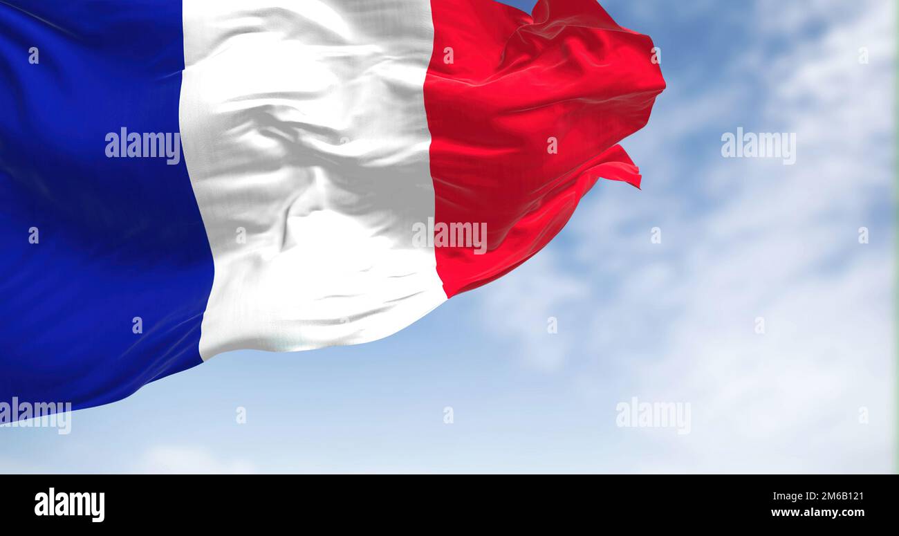Close-up view of the France national flag waving on a clear day. The Republic of France is a ...