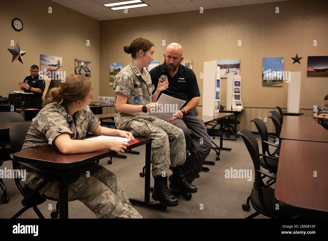 U.S. Air Force 18th Combat Weather Squadron Airmen discuss meterology ...