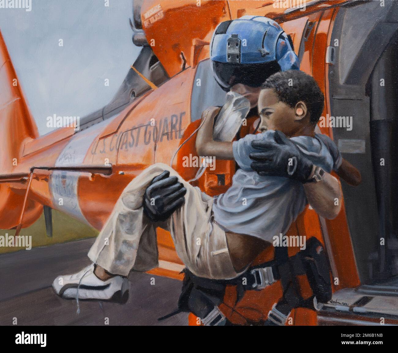 A Coast Guard petty officer from Air Station Miami carries a sick child ...