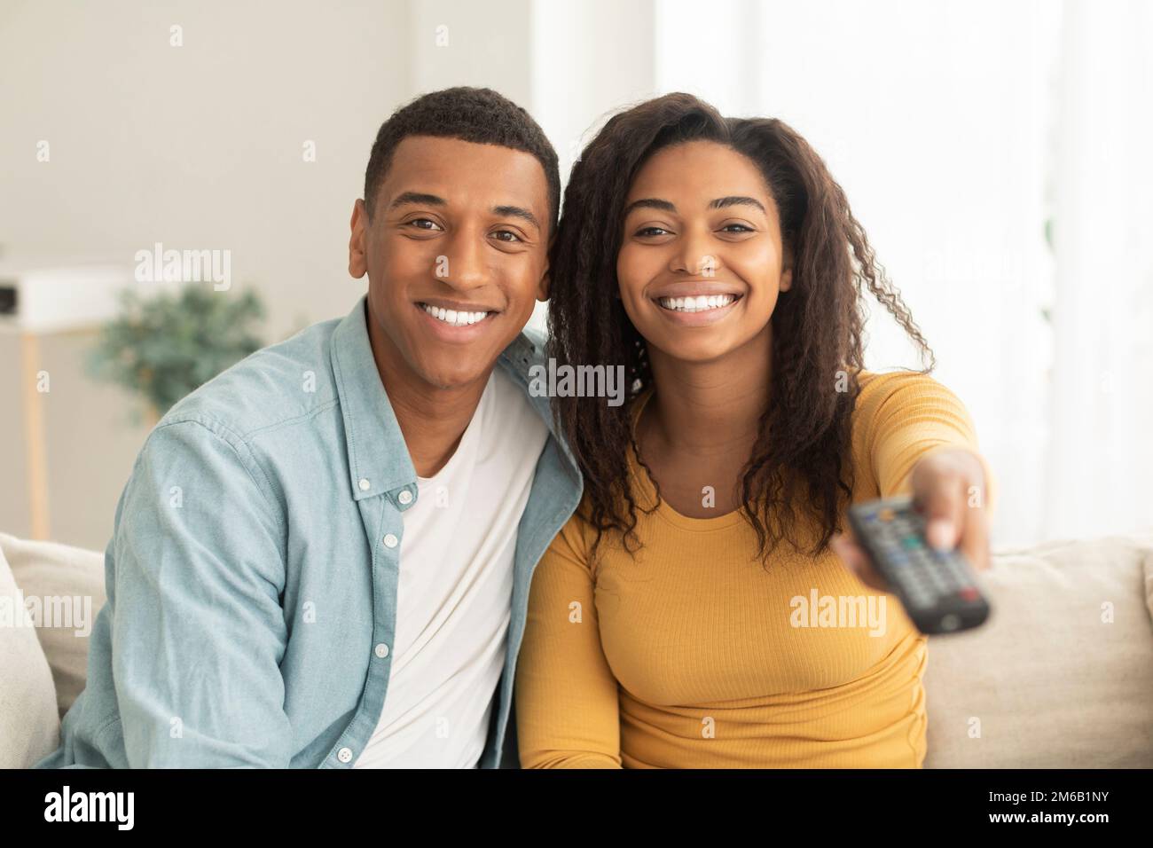 Smiling Millennial African American Husband Hug His Wife Switch