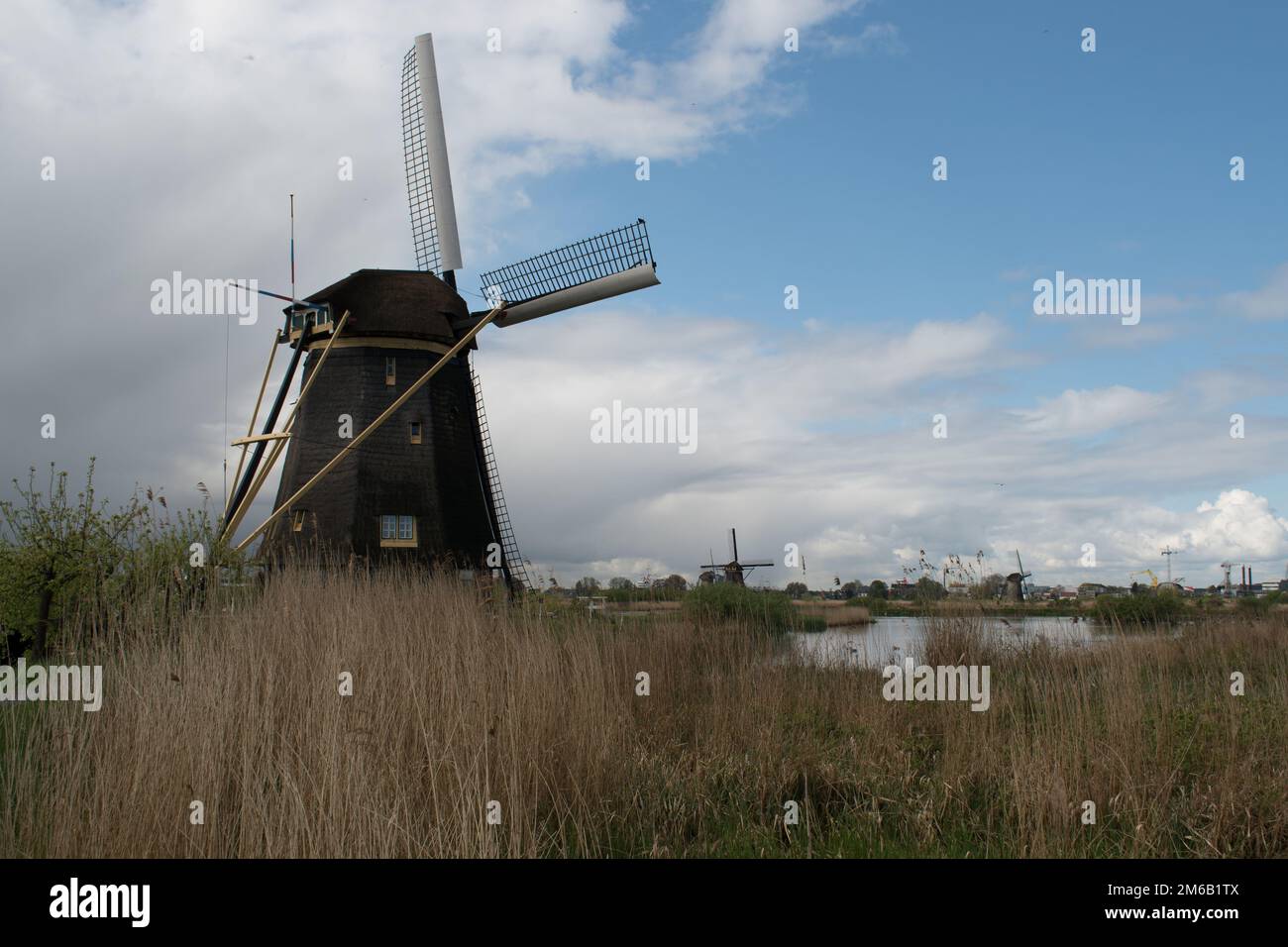 Windmill in Kinderdijk, Netherlands in a cloudy day Stock Photo - Alamy