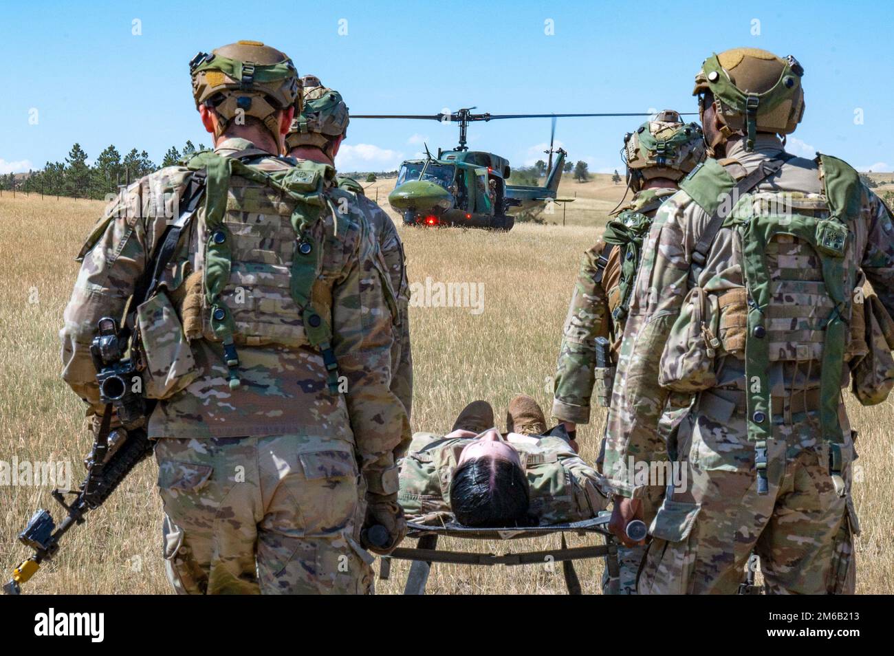 Airmen from the 90th Missile Security Forces Squadron move a simulated ...