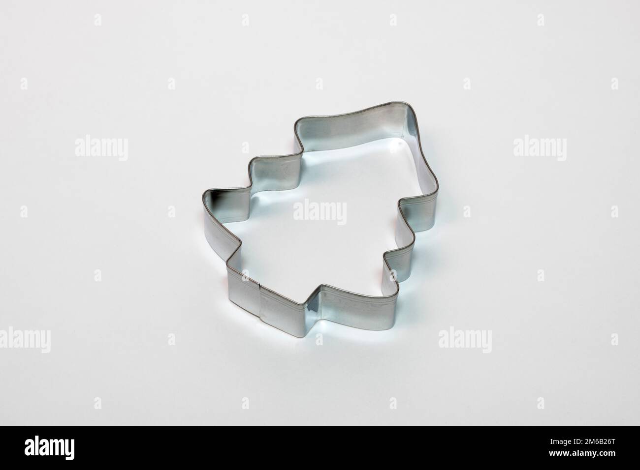 Christmas cookie cutter in the shape of a fir tree, studio shot, white ...