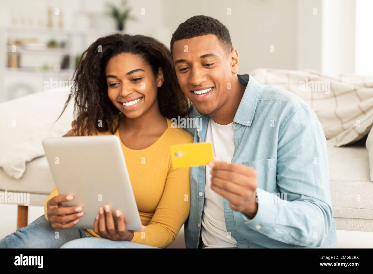 App for online shopping. Glad millennial african american guy hug lady ...