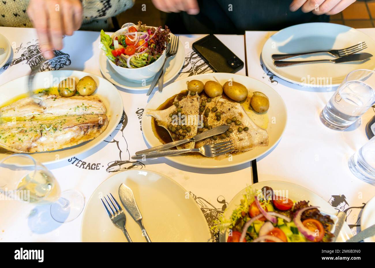 Plates of seafood fish on table, Butley Oysterage restaurant, Orford ...