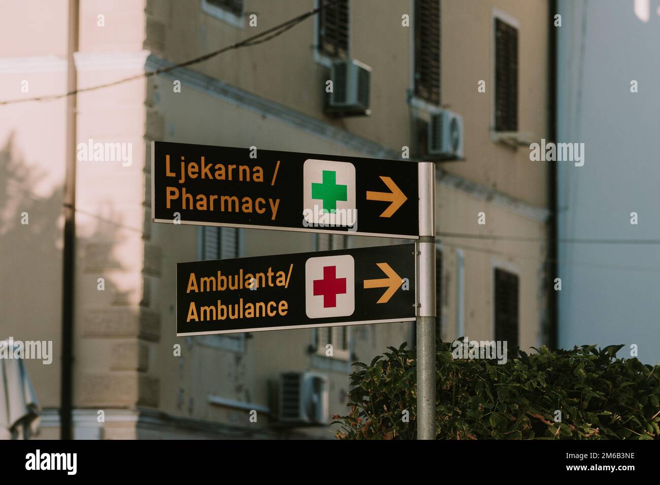 Pharmacy and ambulance sign in the city Stock Photo - Alamy