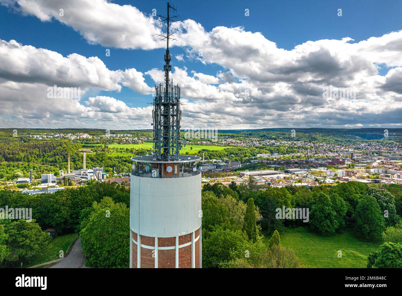 Aerial view of the water tower and green city in the background ...