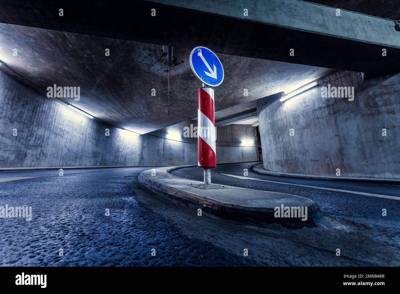 Driveway in underground car park with traffic sign at night, Pforzheim ...