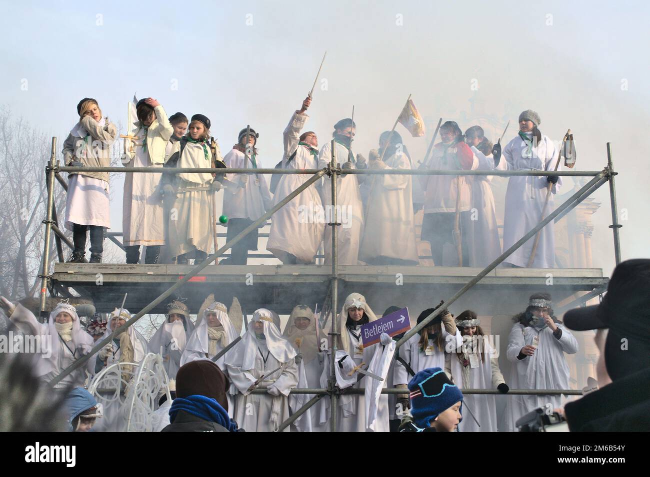 A volunteers dressed as angels during the annual Three Kings Day Parade ...