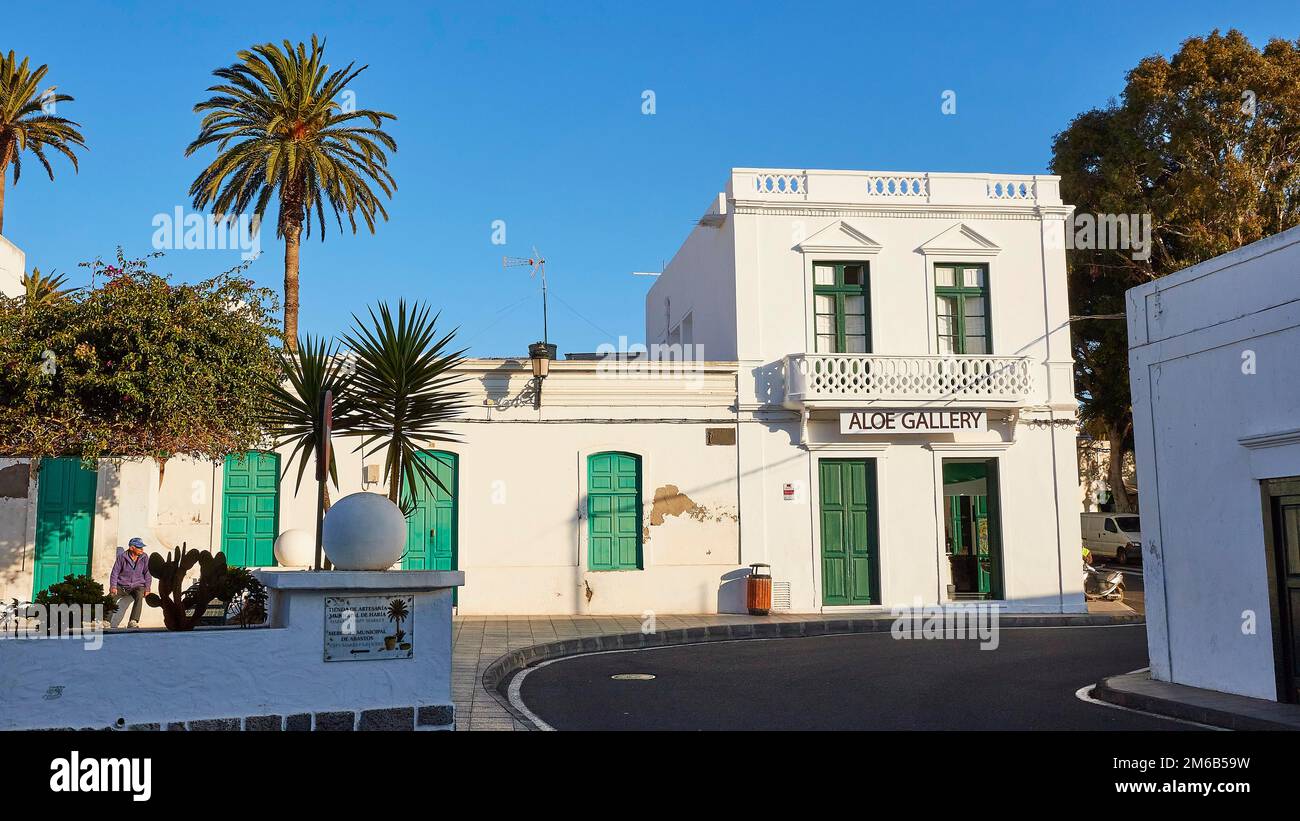Old town of Haria, village square, palm trees, white houses, green ...