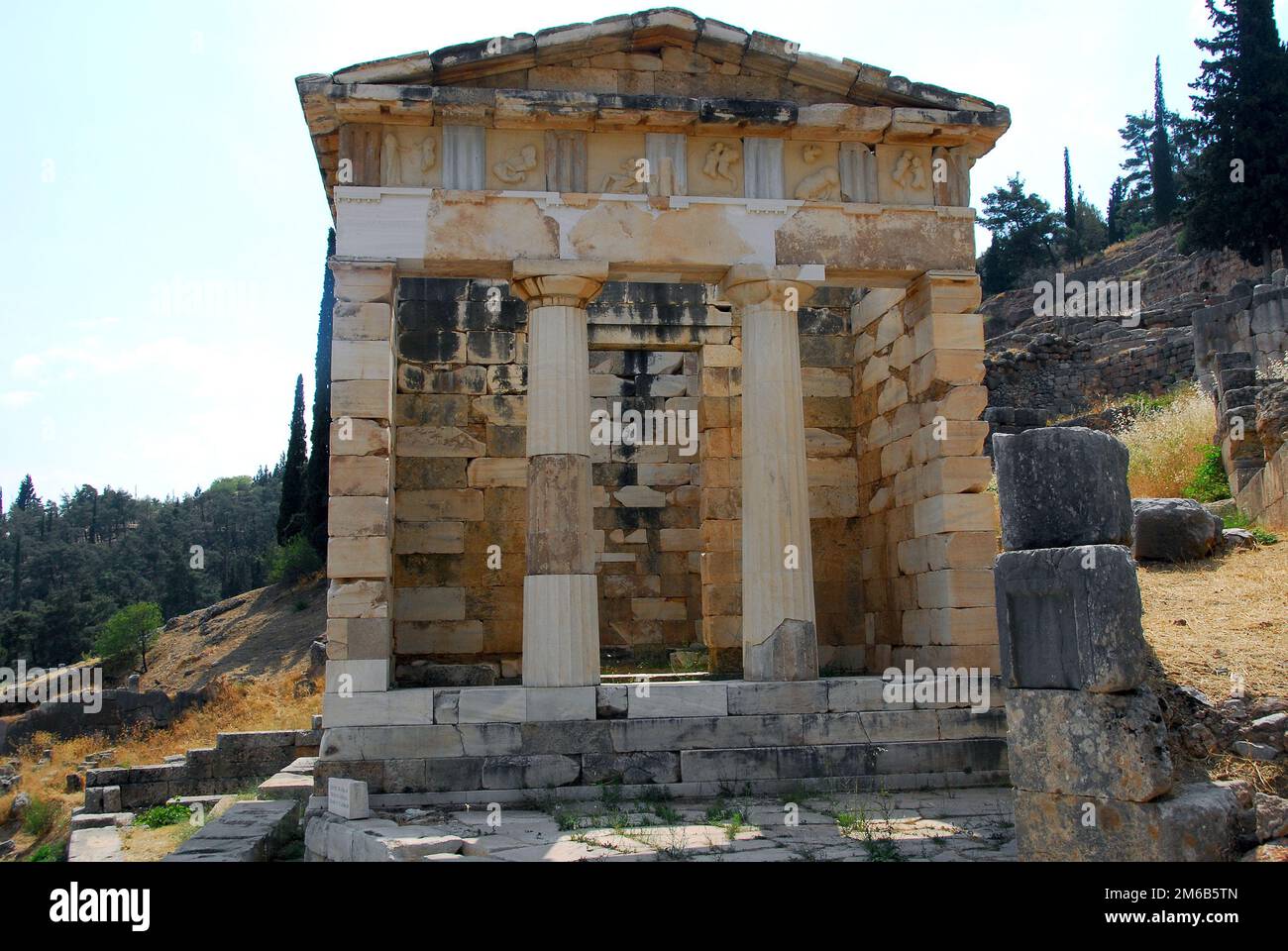 The reconstructed Treasury of the Athenians, Delphi, ancient sacred ...