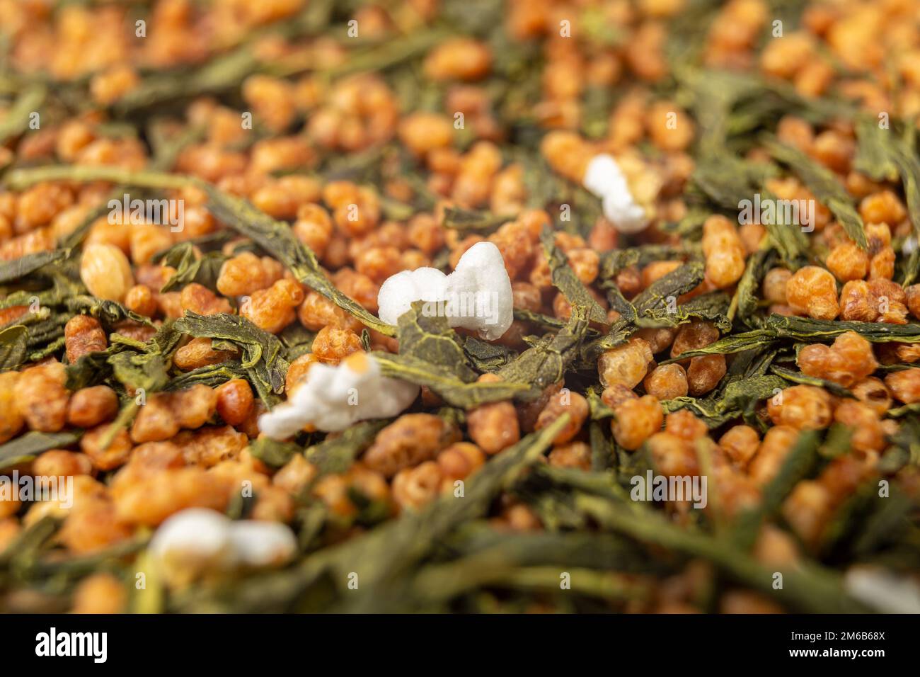 Green tea Japanese Genmaicha background. Green tea mixed with roasted ...