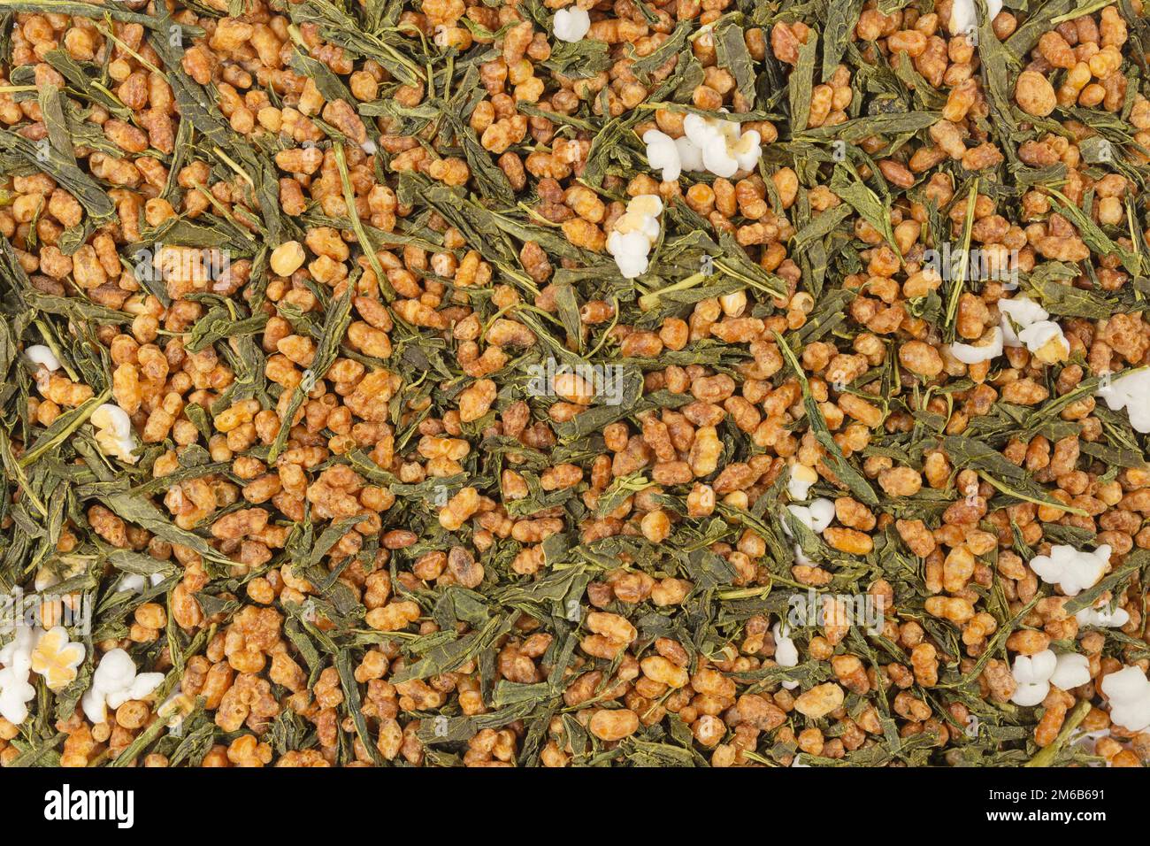 Green tea Japanese Genmaicha background. Green tea mixed with roasted ...