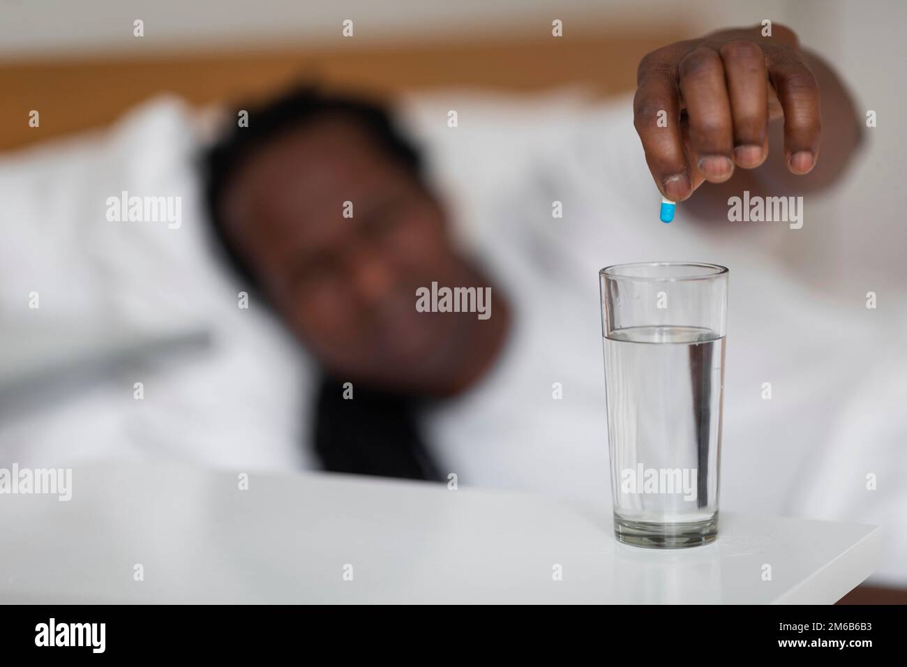 Fast Treatment. Sick Black Man Putting Medicine Pill Into Glass Of ...