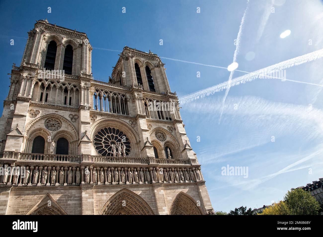 The front facade and bell towers of Notre Dame Cathedral in Paris ...