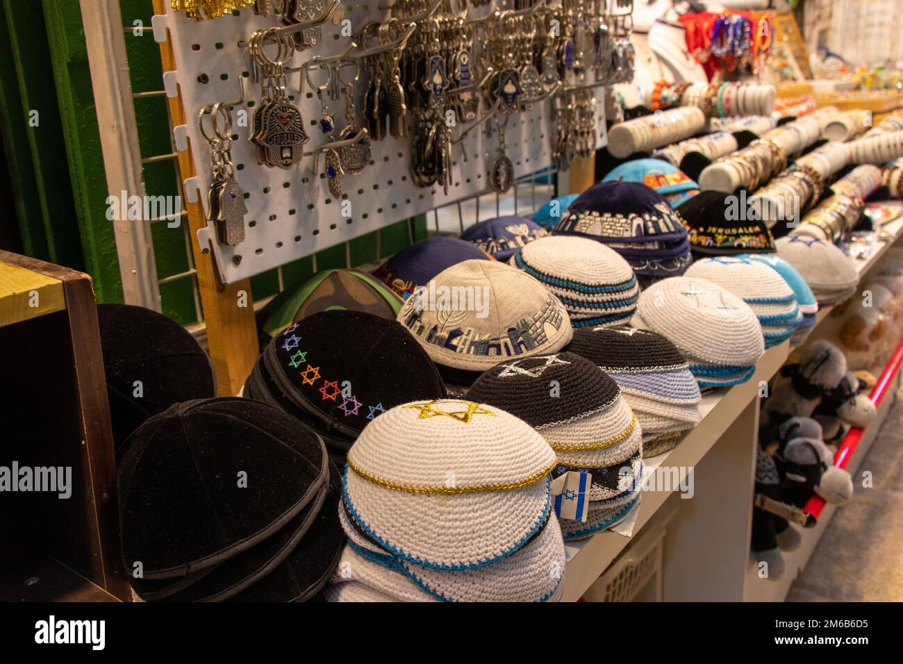 Colorful traditional jewish yarmulke piles for sale at the old city of ...