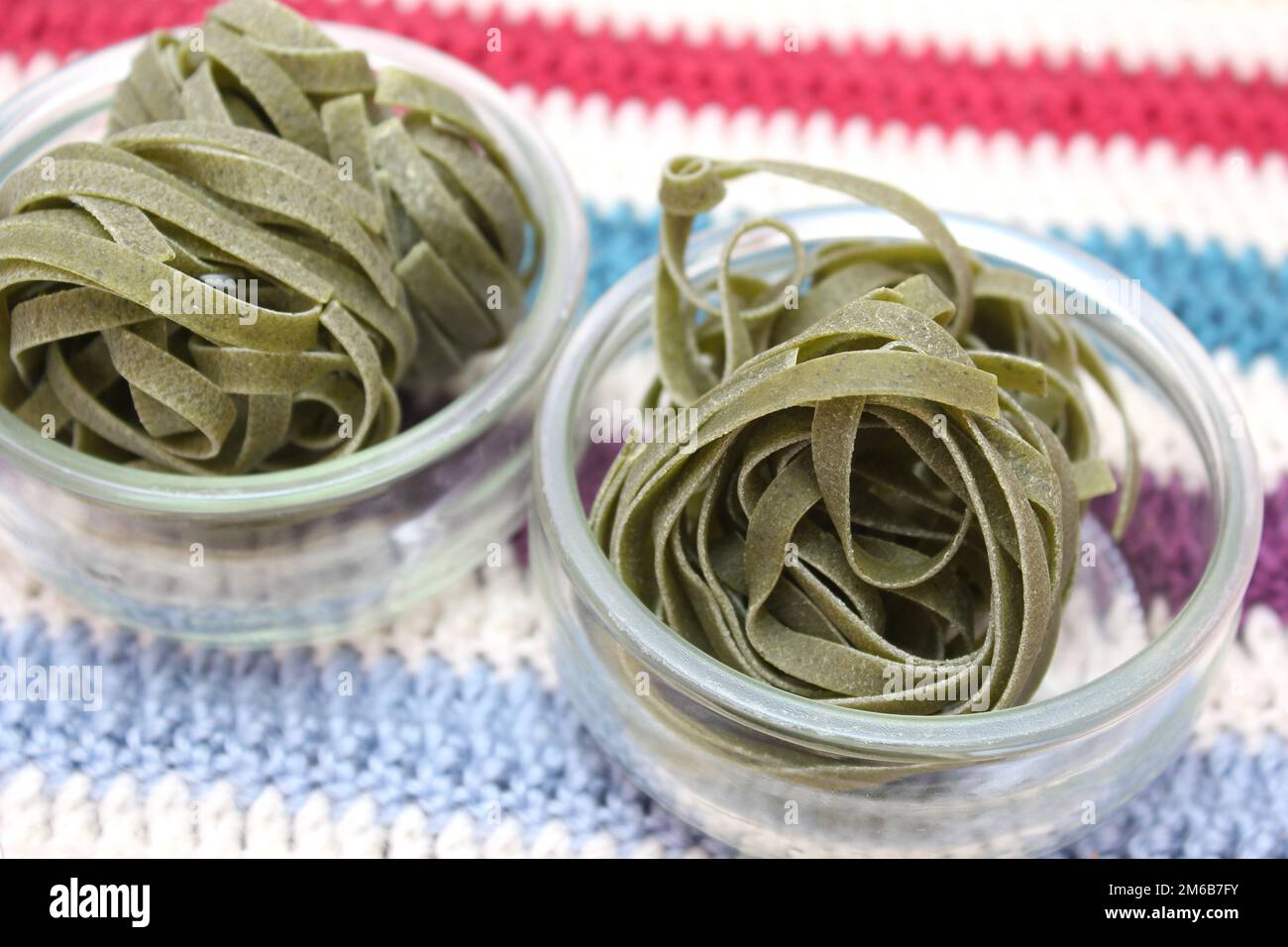 Raw uncooked green pasta hi-res stock photography and images - Alamy