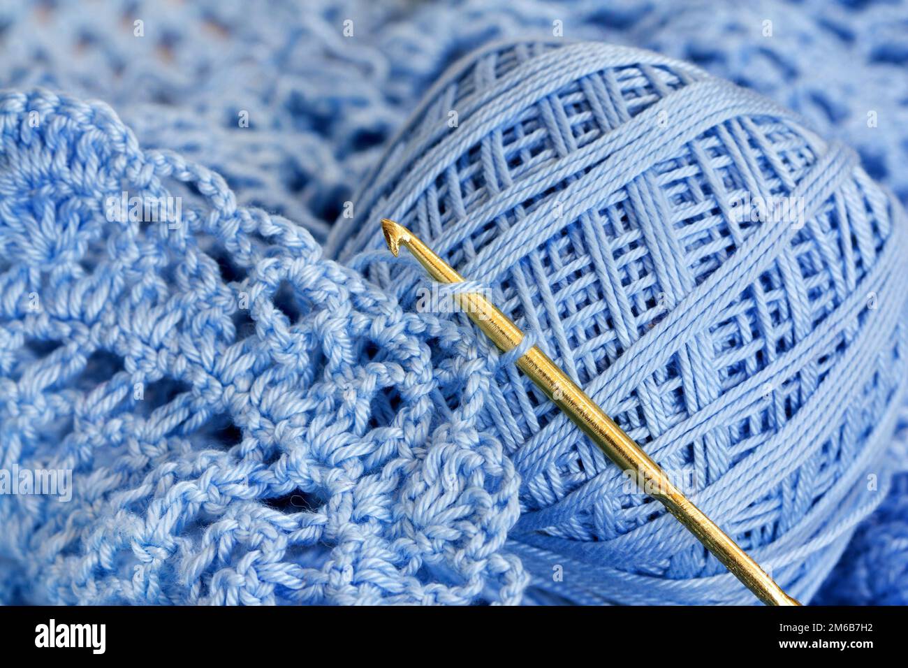 crochet stuff for beatiful decoration with blue thread and golden ...