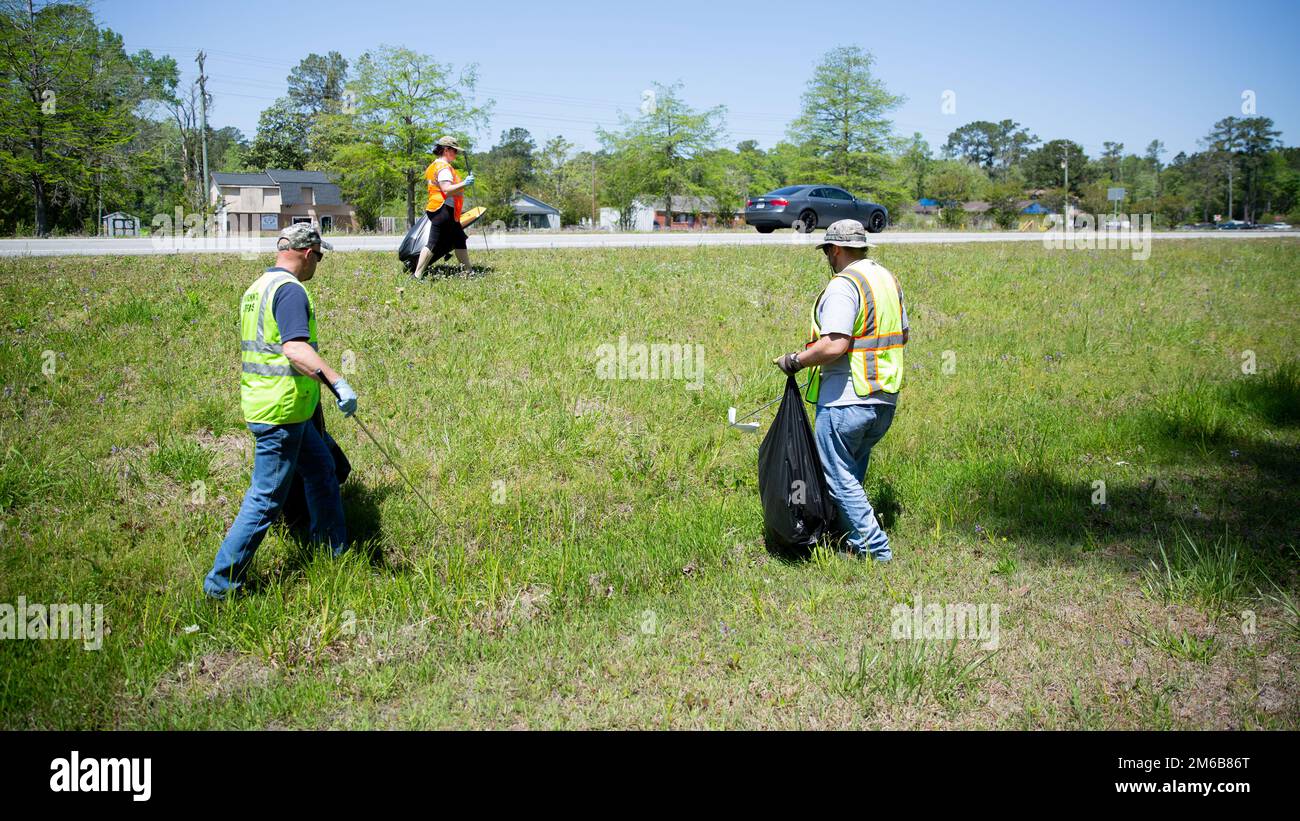 Volunteers with Installation & Environment Department, participate in ...