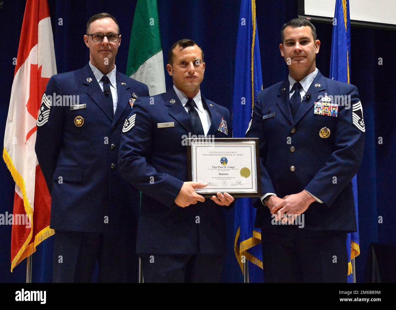 U.S. Air Force Tech. Sgt. Paul Cange receives a Distinguished Graduate ...