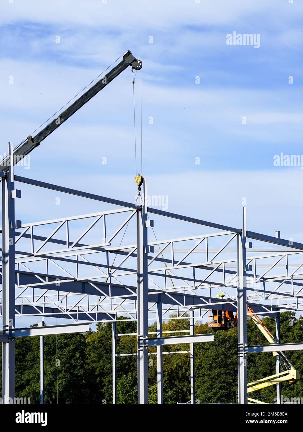 New building steel framework assembly using telescopic boom crane and ...
