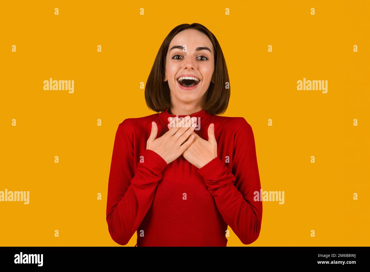 Woman touching her chest hi-res stock photography and images - Alamy