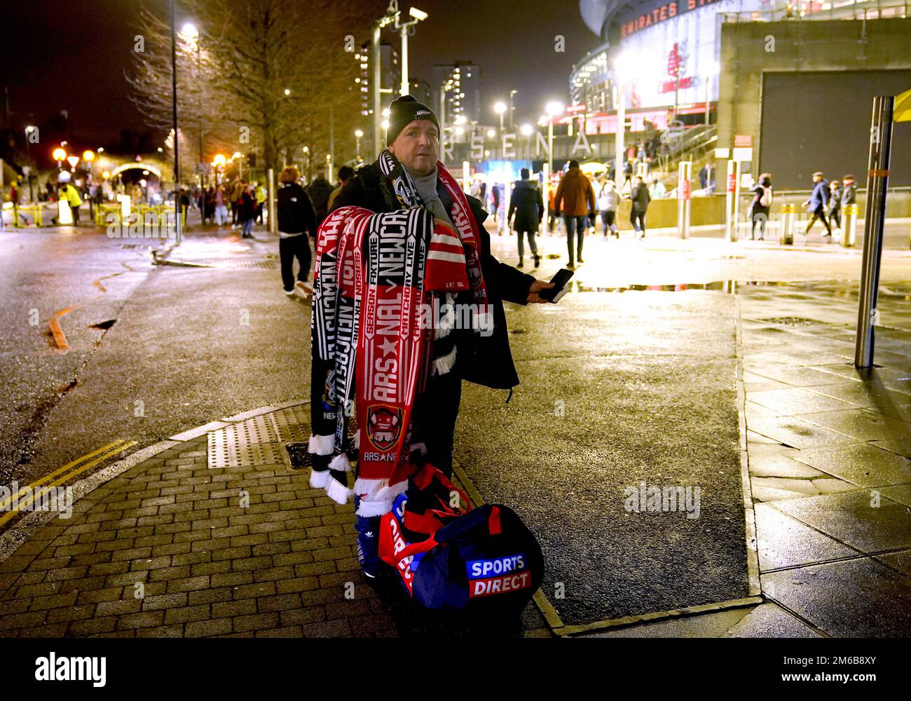 A street vendor sells commemorative match scarves ahead of the Premier ...