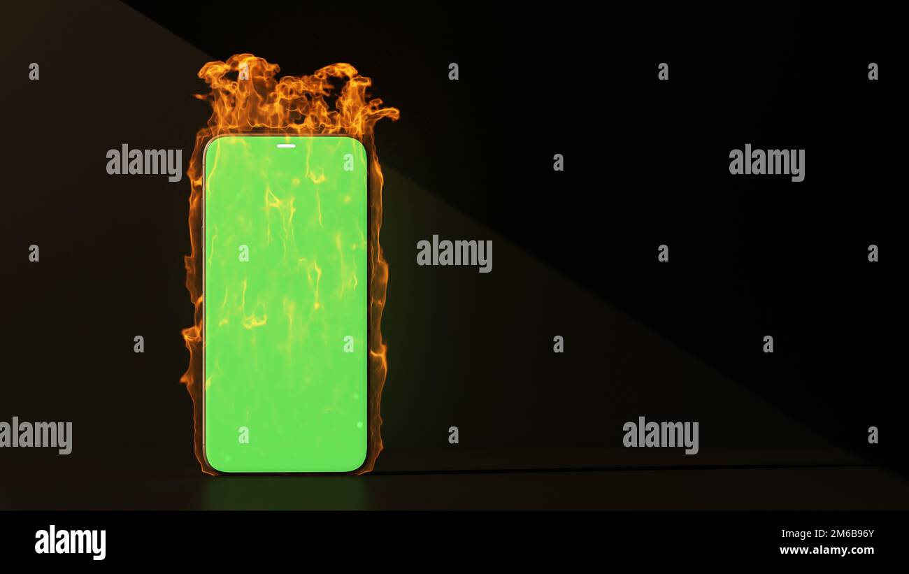 burning smartphone with green screen on black background with copy ...