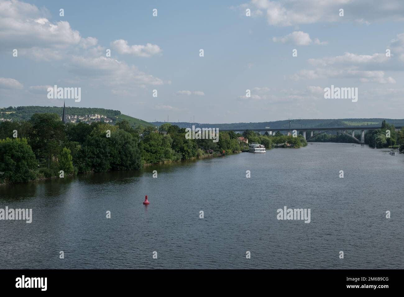 The German river Main with clear water with ship and train bridge in ...