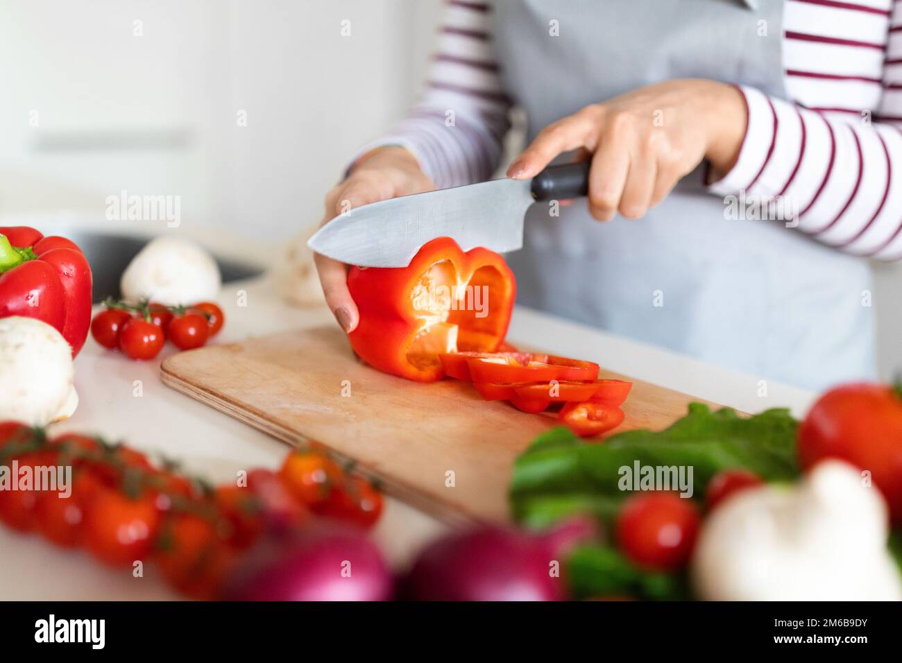 Female hands cutting vegetables hi-res stock photography and images - Alamy