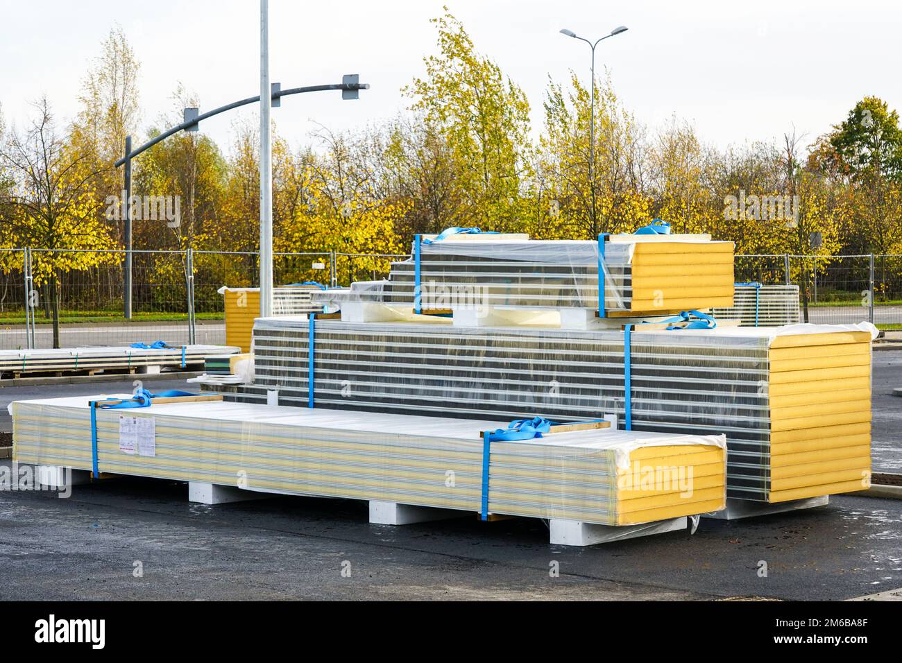 Stacks of delivered new modern prefabricated thermally insulated facade ...