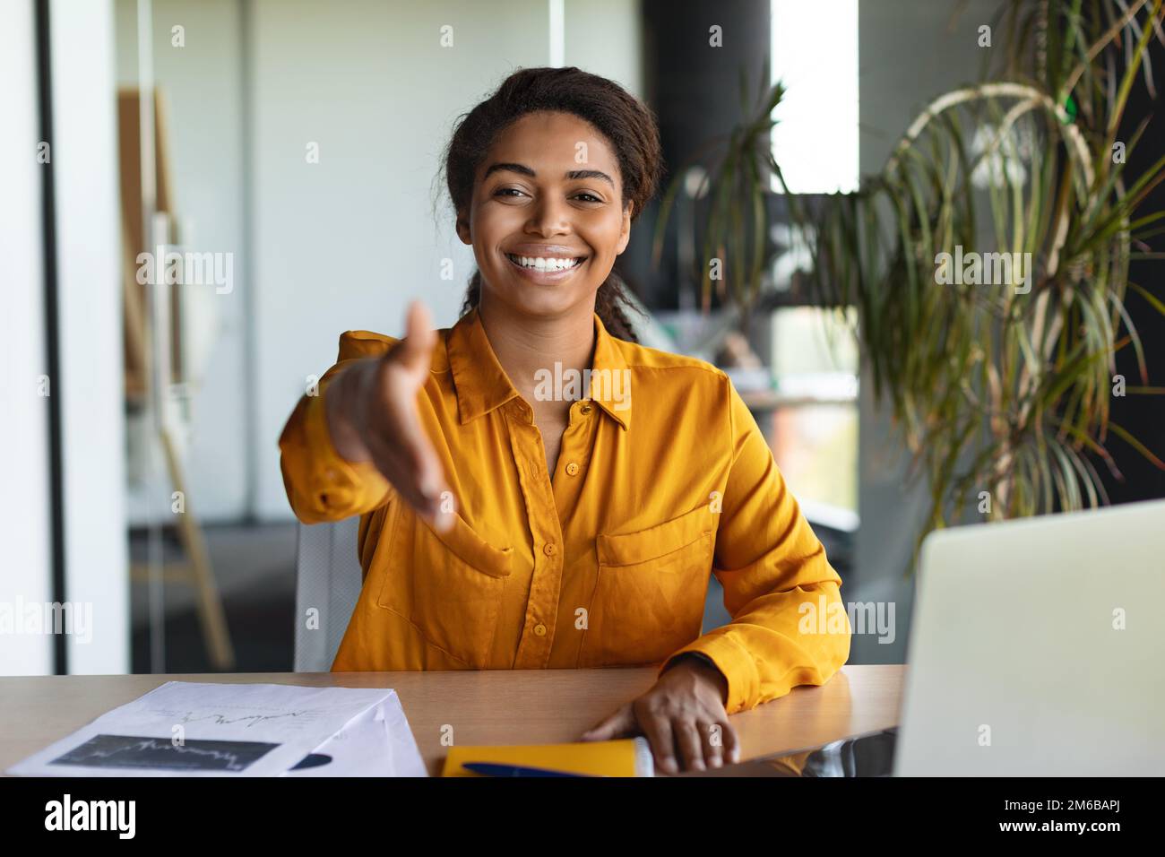 Nice to meet you. Happy female hr manager greeting somebody after ...