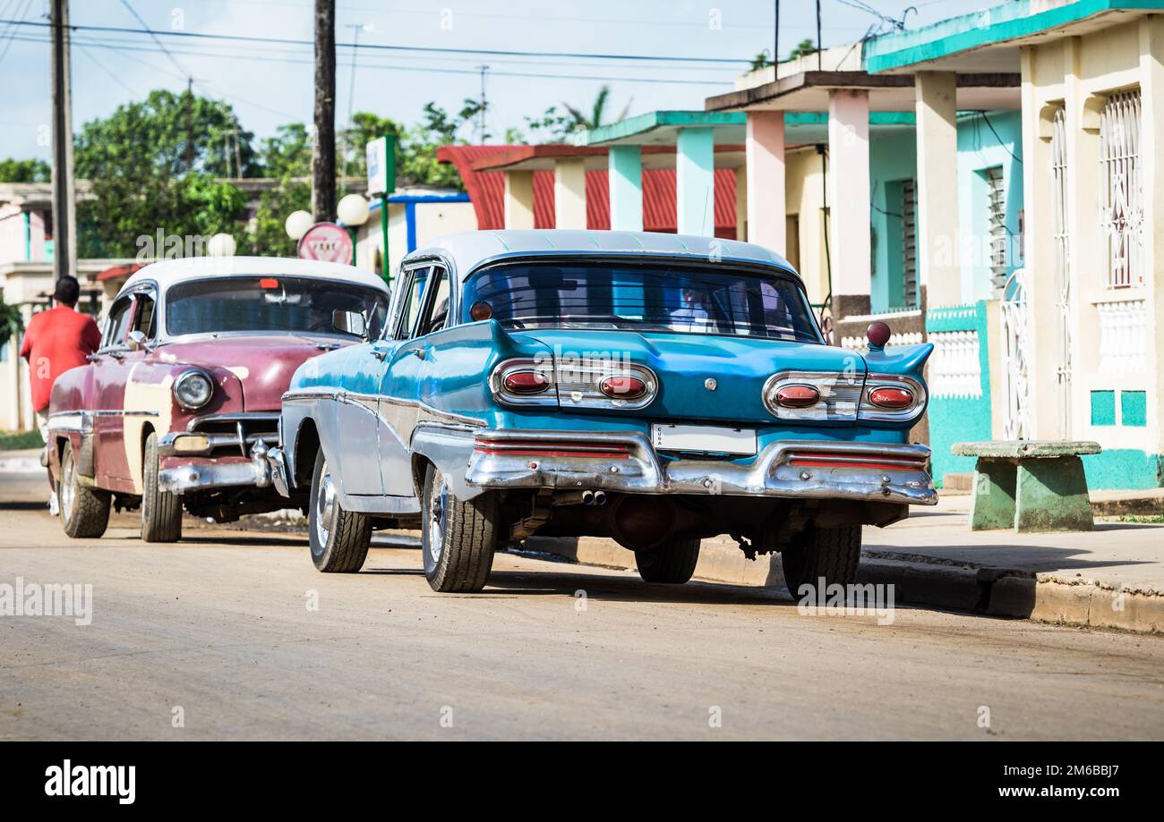 Blue American classic car parked on the road in the countryside of Cuba ...