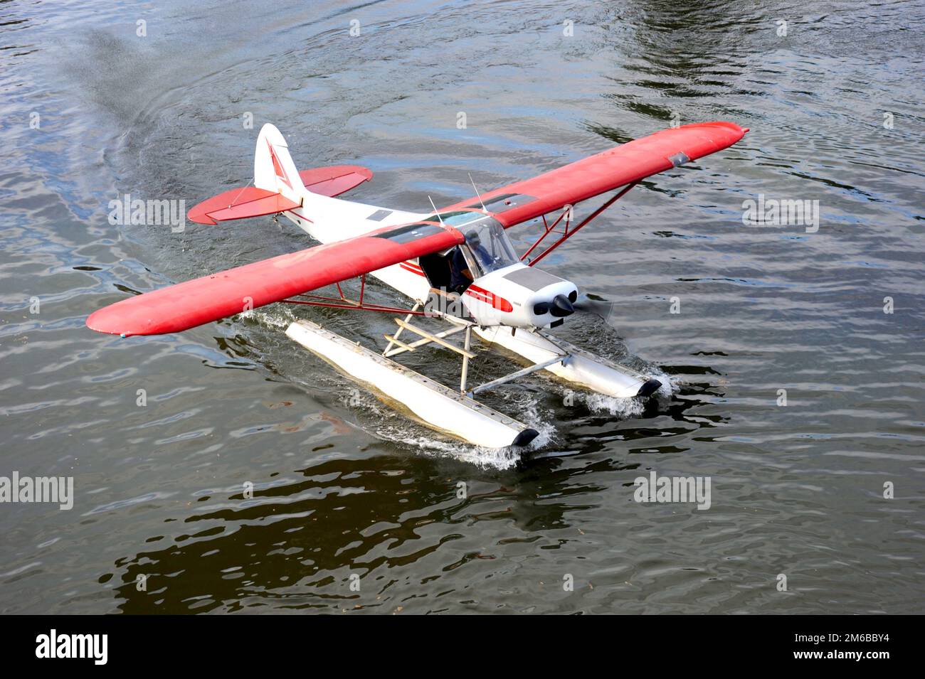 An Alaskan seaplane is floating on the Chena River getting ready for ...