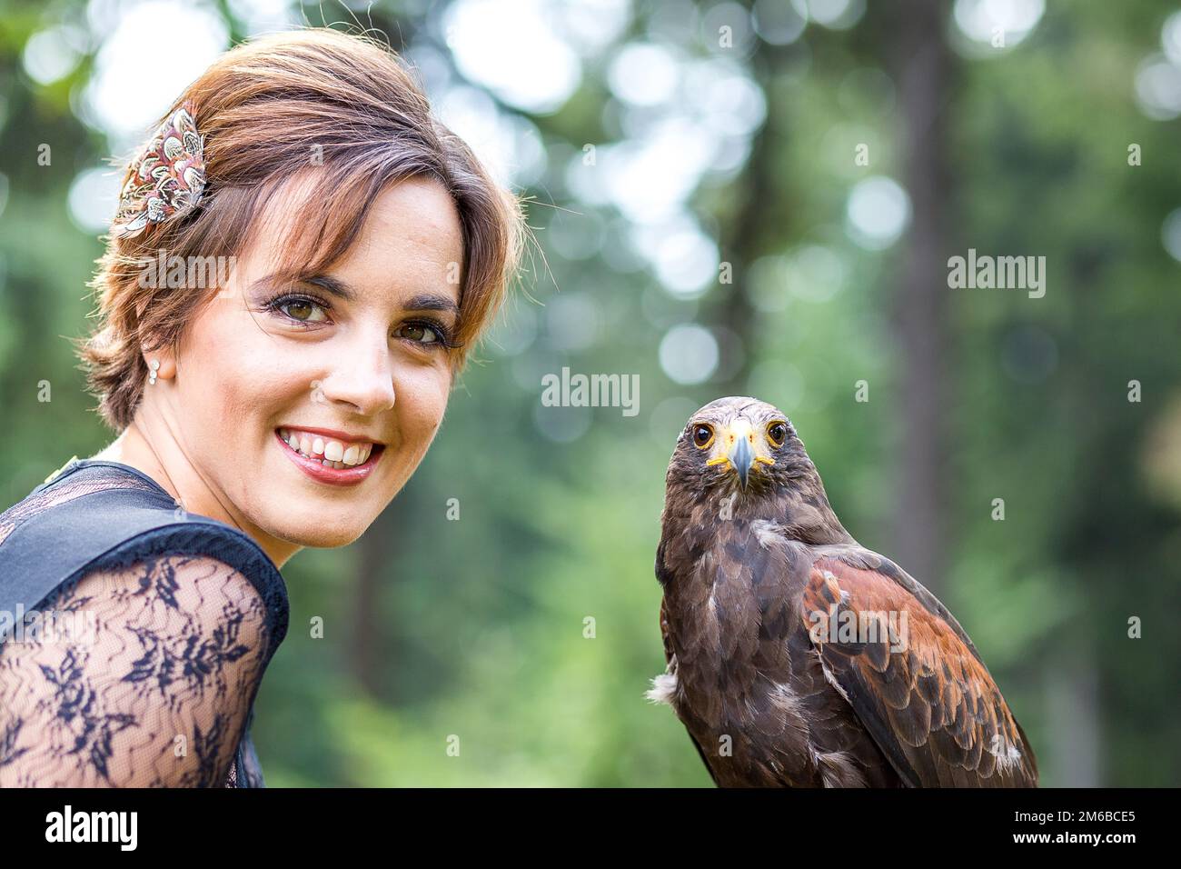 The Lady with the harris hawk Stock Photo - Alamy