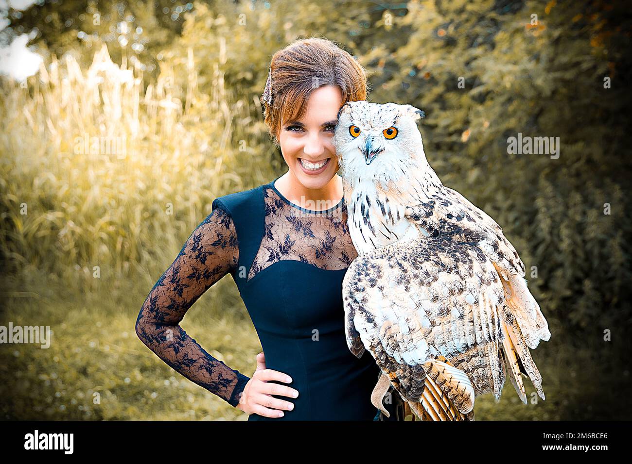 The owl with the lady Stock Photo - Alamy