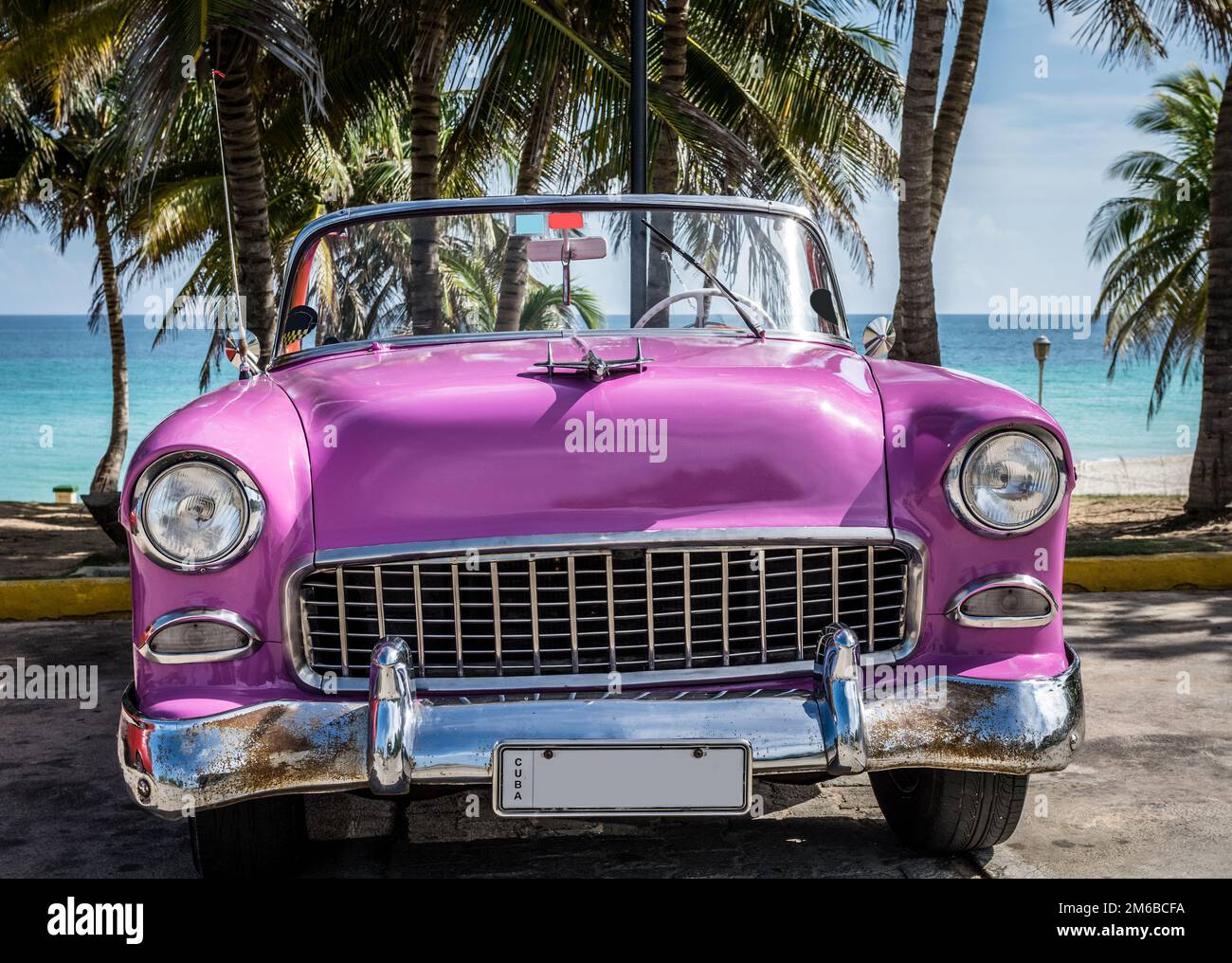 Pink vintage car cabriolet on the beach of Varadero in Cuba Stock Photo ...