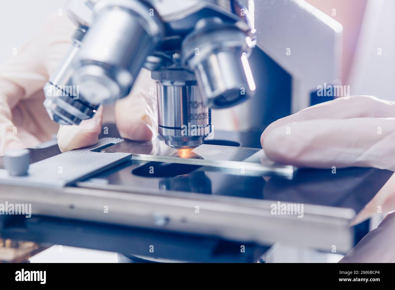 Scientist hands with microscope Stock Photo - Alamy